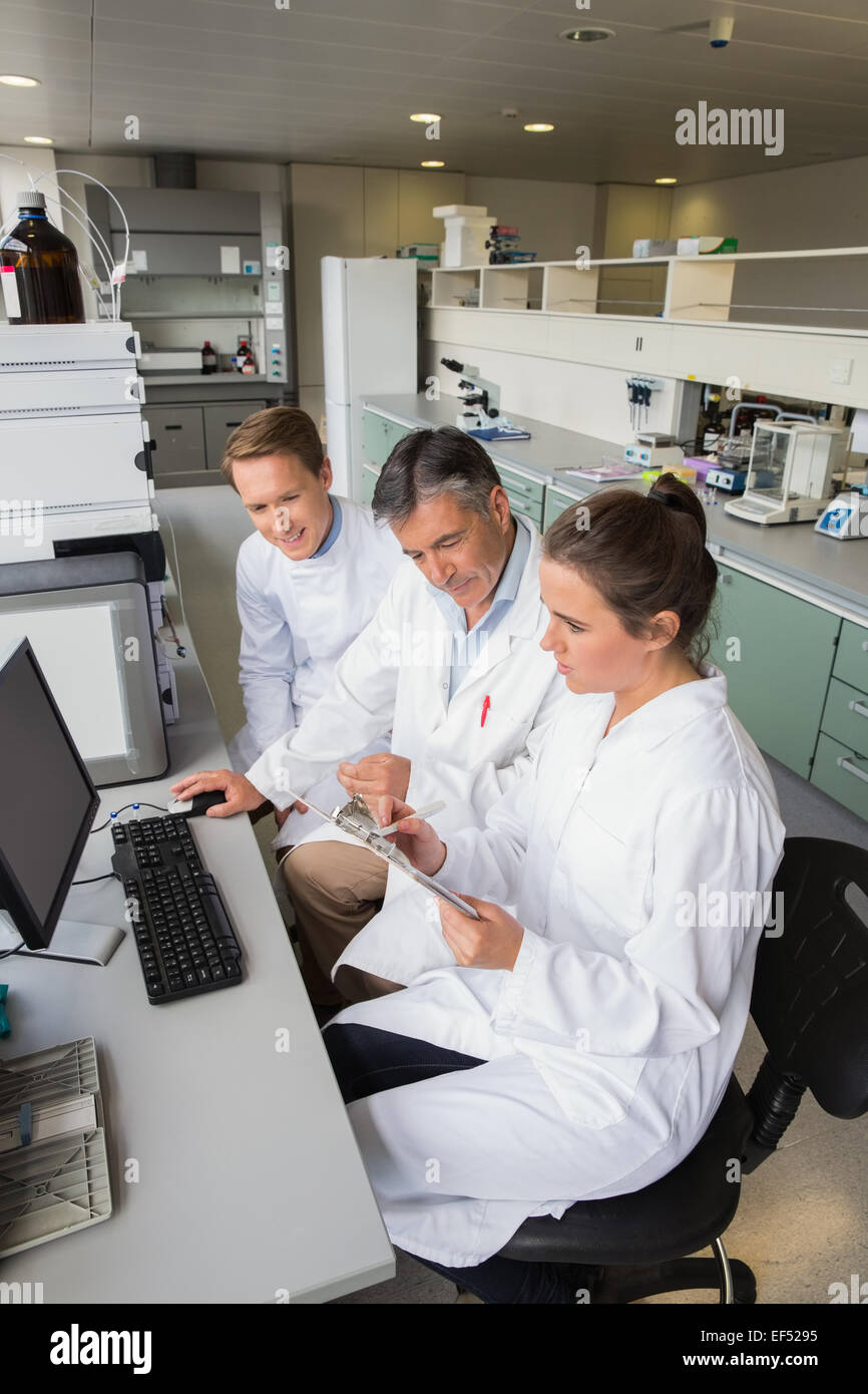 Team of scientists working together Stock Photo - Alamy