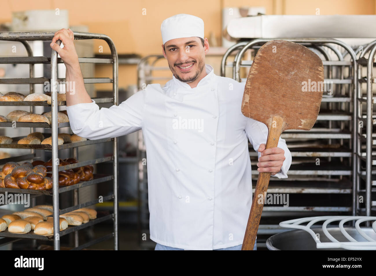 Smiling baker looking at camera Stock Photo - Alamy