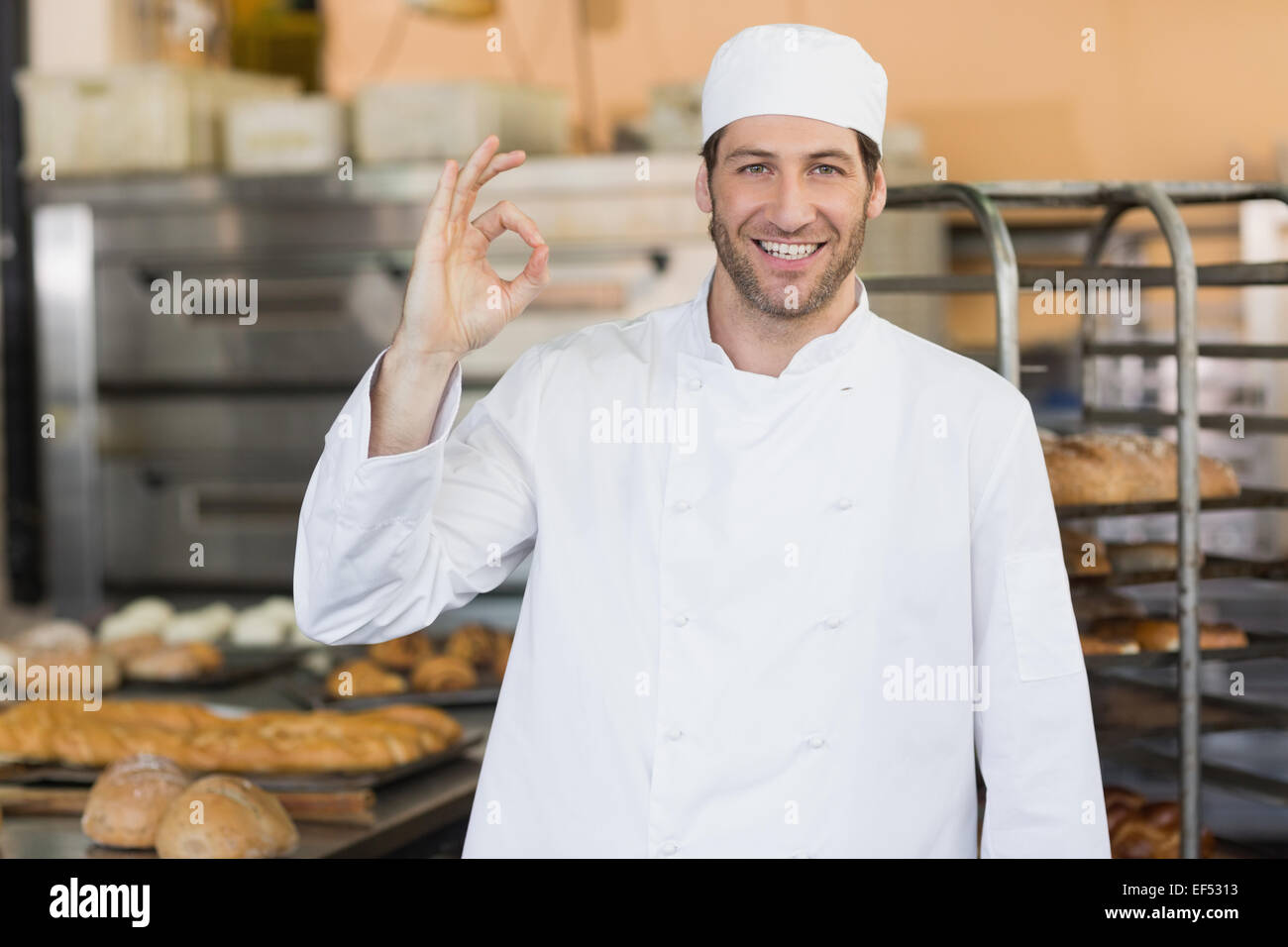 Smiling baker looking at camera Stock Photo - Alamy