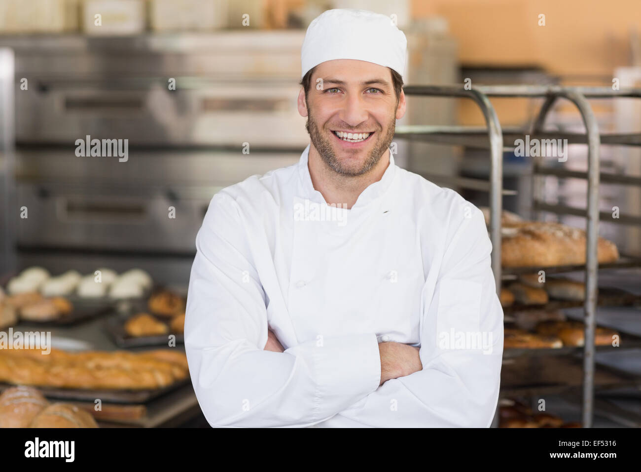 Smiling baker looking at camera Stock Photo - Alamy