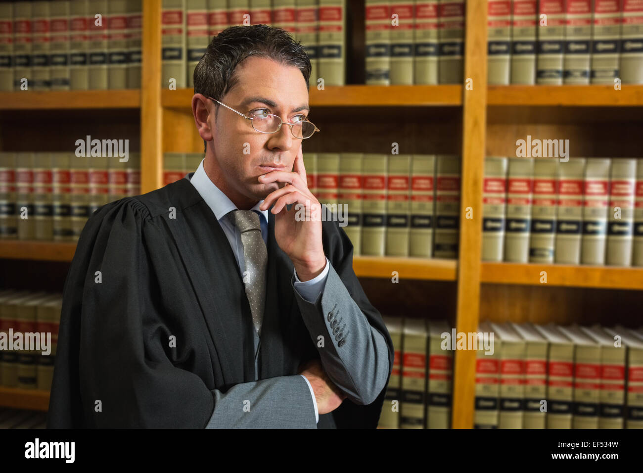 Lawyer thinking in the law library Stock Photo - Alamy