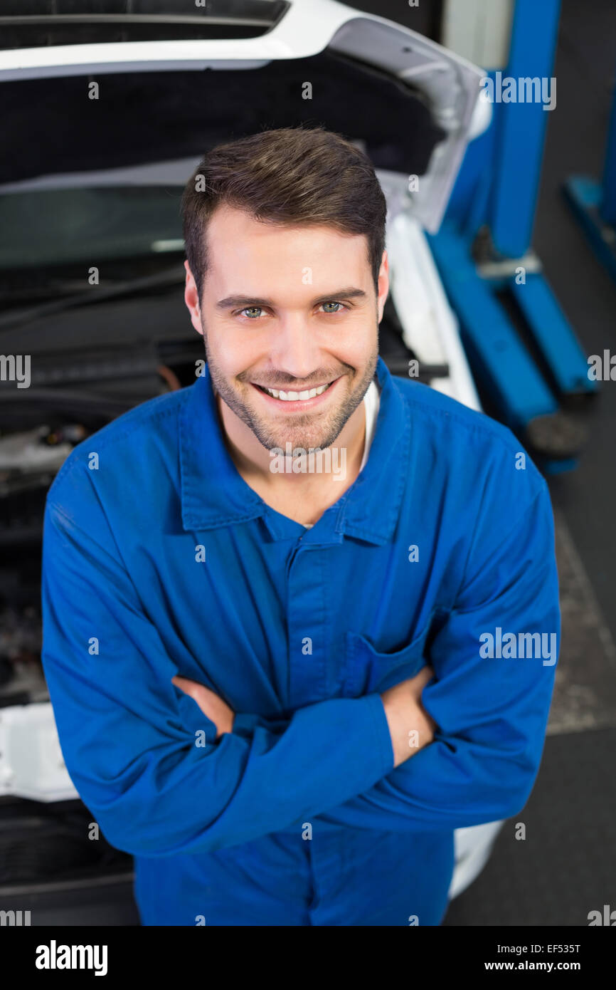 Mechanic smiling at the camera Stock Photo - Alamy
