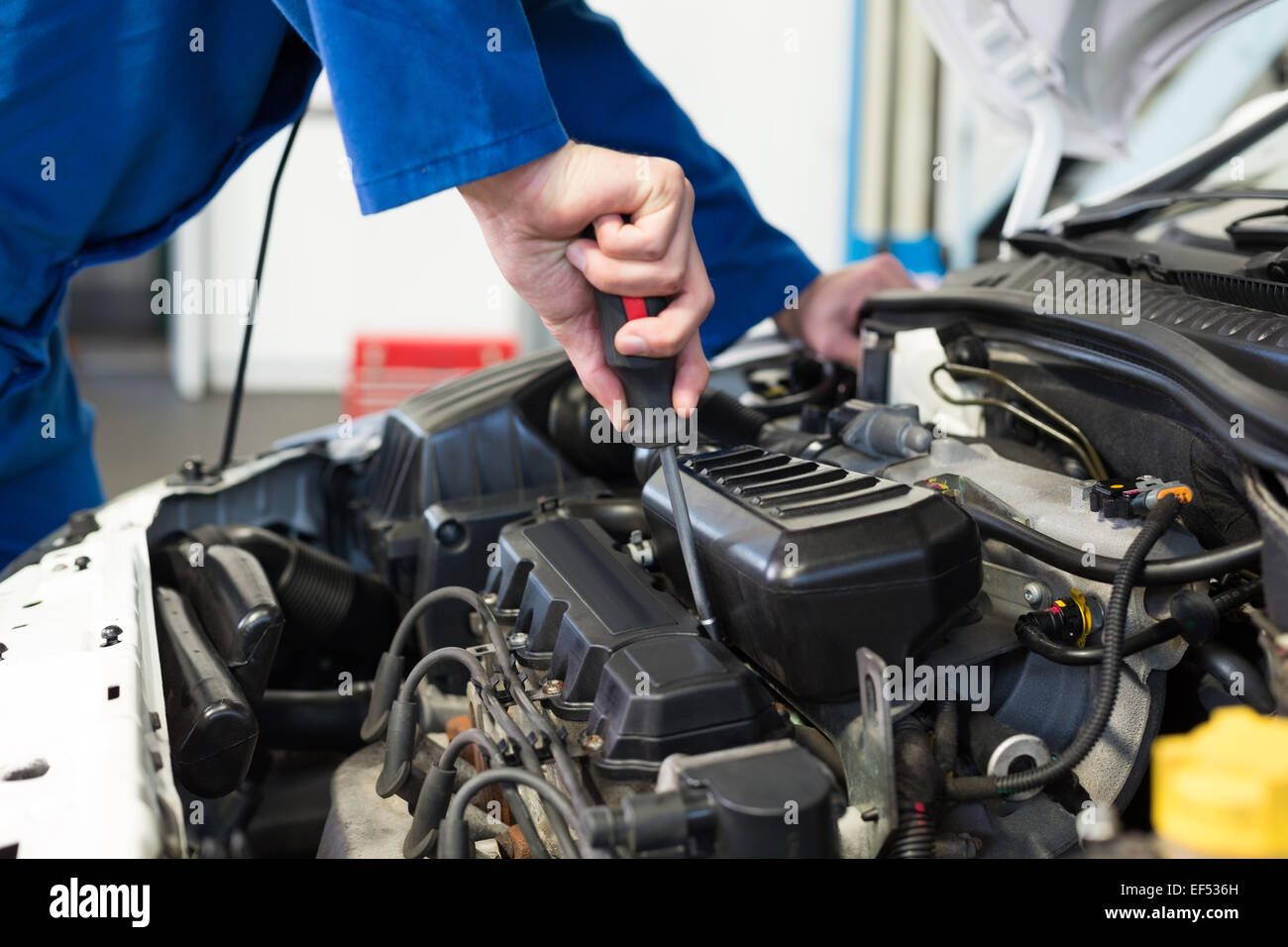 Mechanic using screwdriver engine hi-res stock photography and images ...
