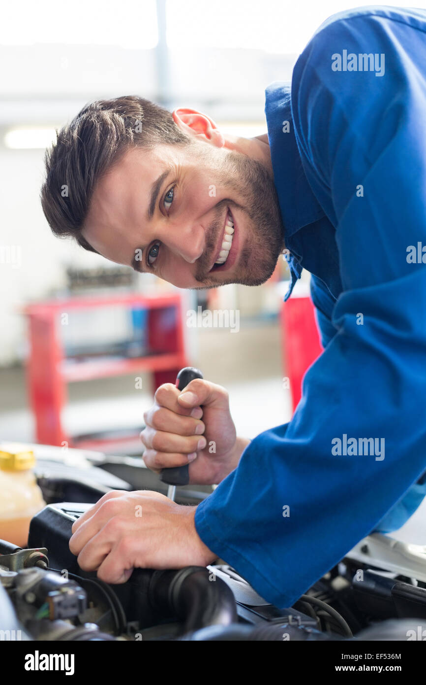 Mechanic using screwdriver engine hi-res stock photography and images ...