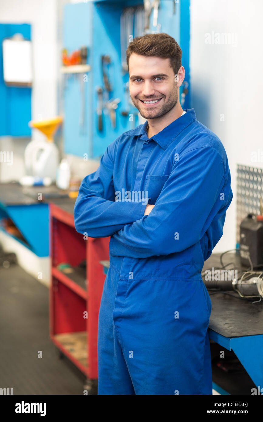 Mechanic smiling at the camera Stock Photo - Alamy
