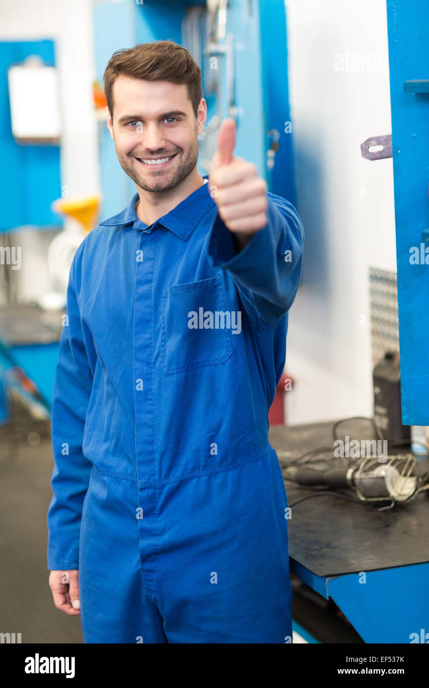 Mechanic smiling at the camera Stock Photo - Alamy