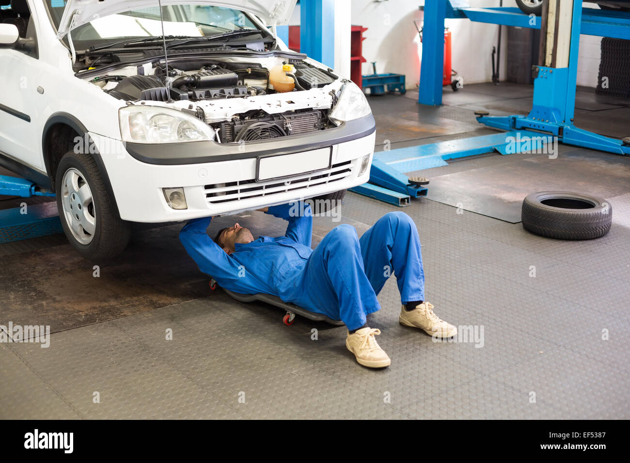 Mechanic under car hi-res stock photography and images - Alamy