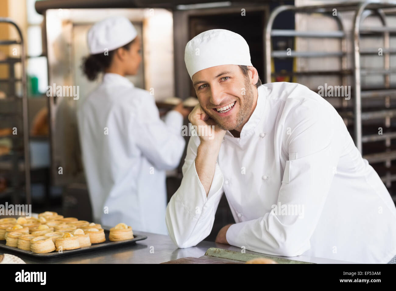 Baker smiling at the camera Stock Photo - Alamy