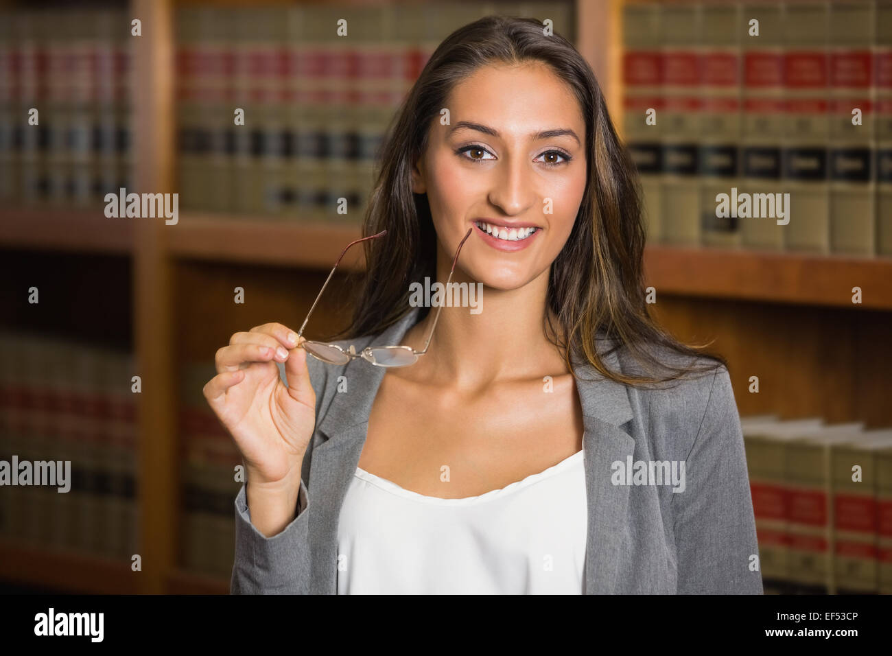 Pretty lawyer in the law library Stock Photo - Alamy