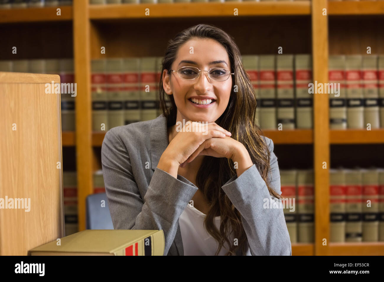 Pretty lawyer in the law library Stock Photo - Alamy