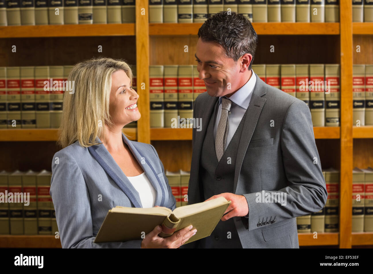 Lawyers reading book in the law library Stock Photo - Alamy