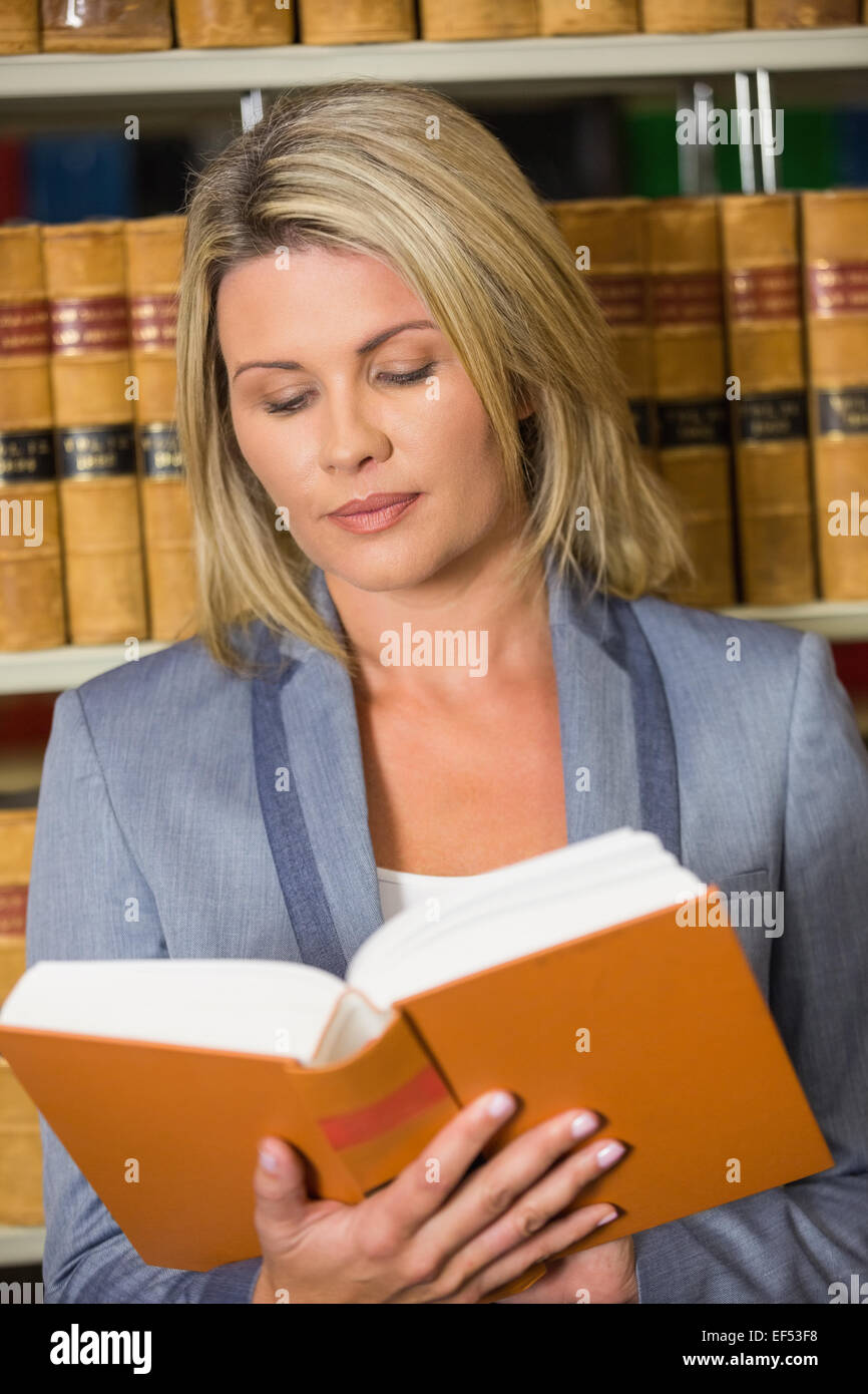 Lawyer reading book in the law library Stock Photo - Alamy