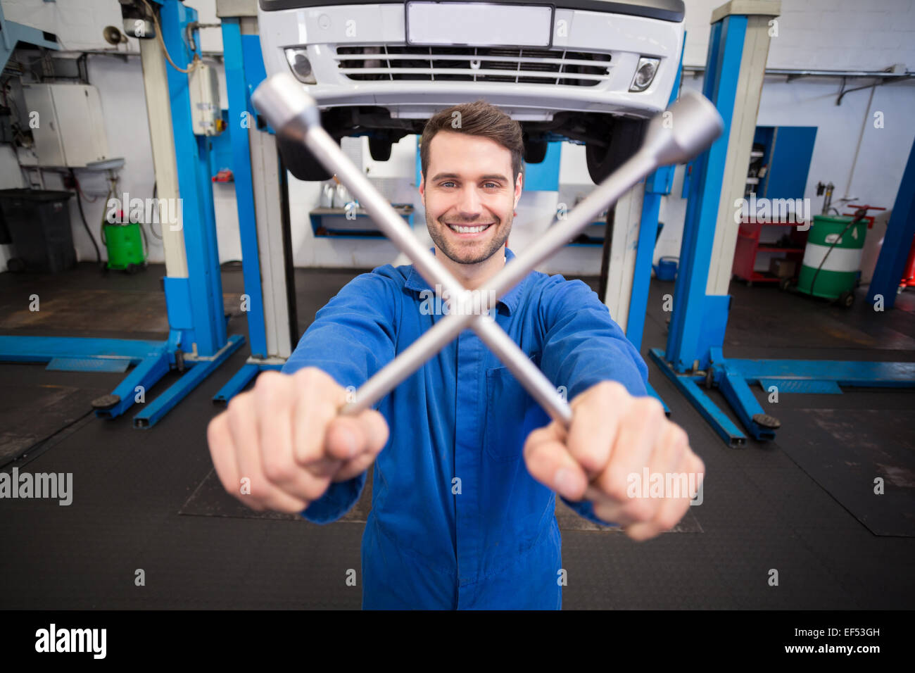 Mechanic smiling at the camera Stock Photo - Alamy
