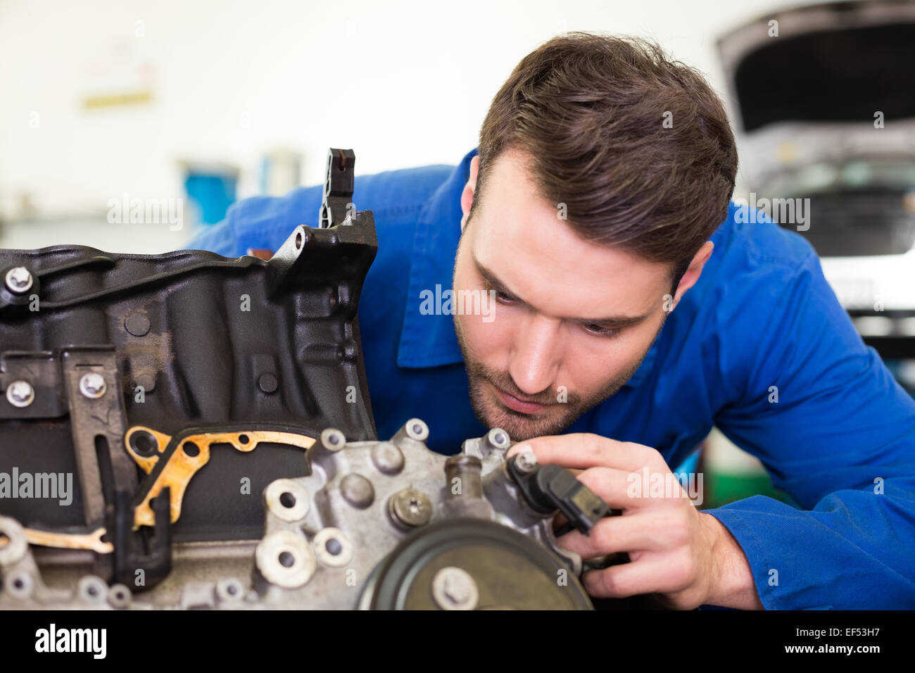 Mechanic working on an engine Stock Photo - Alamy