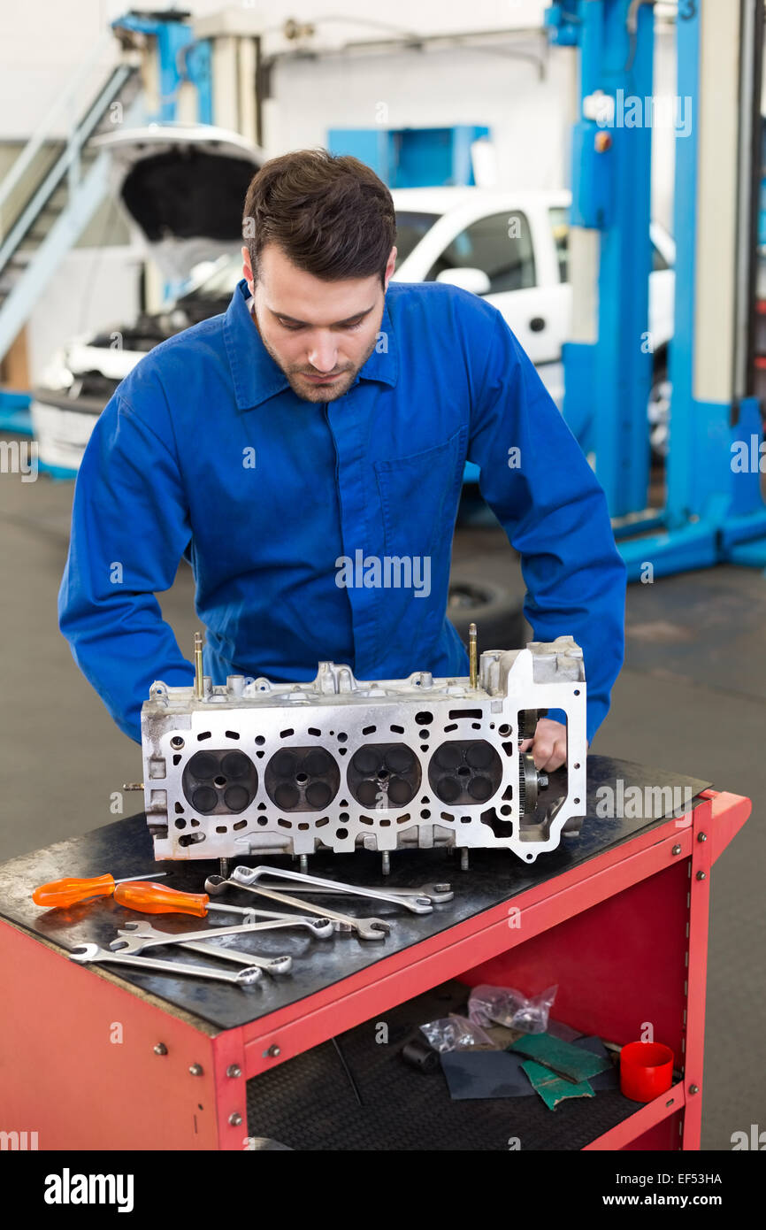 Mechanic working on an engine Stock Photo - Alamy
