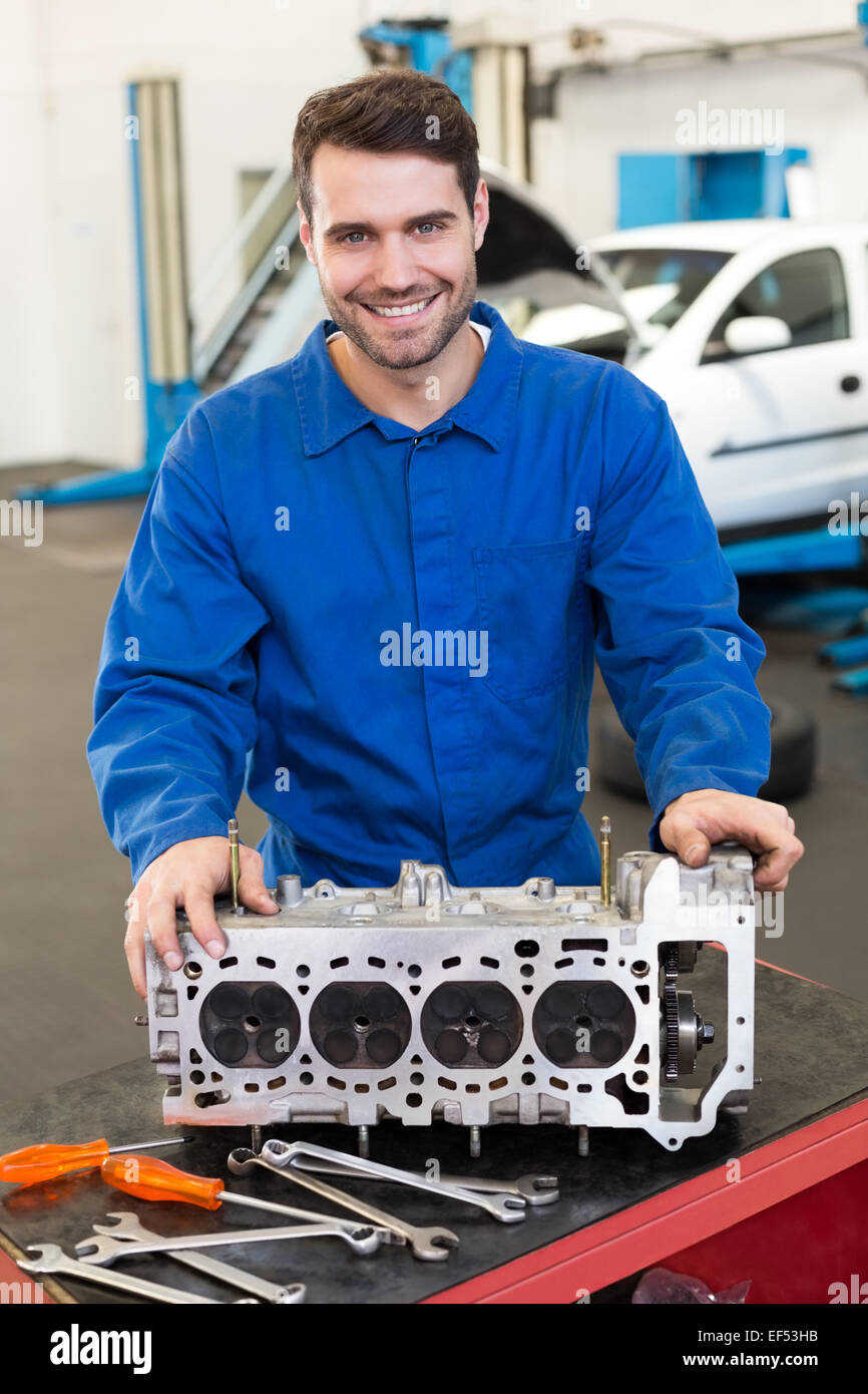 Mechanic working on an engine Stock Photo - Alamy