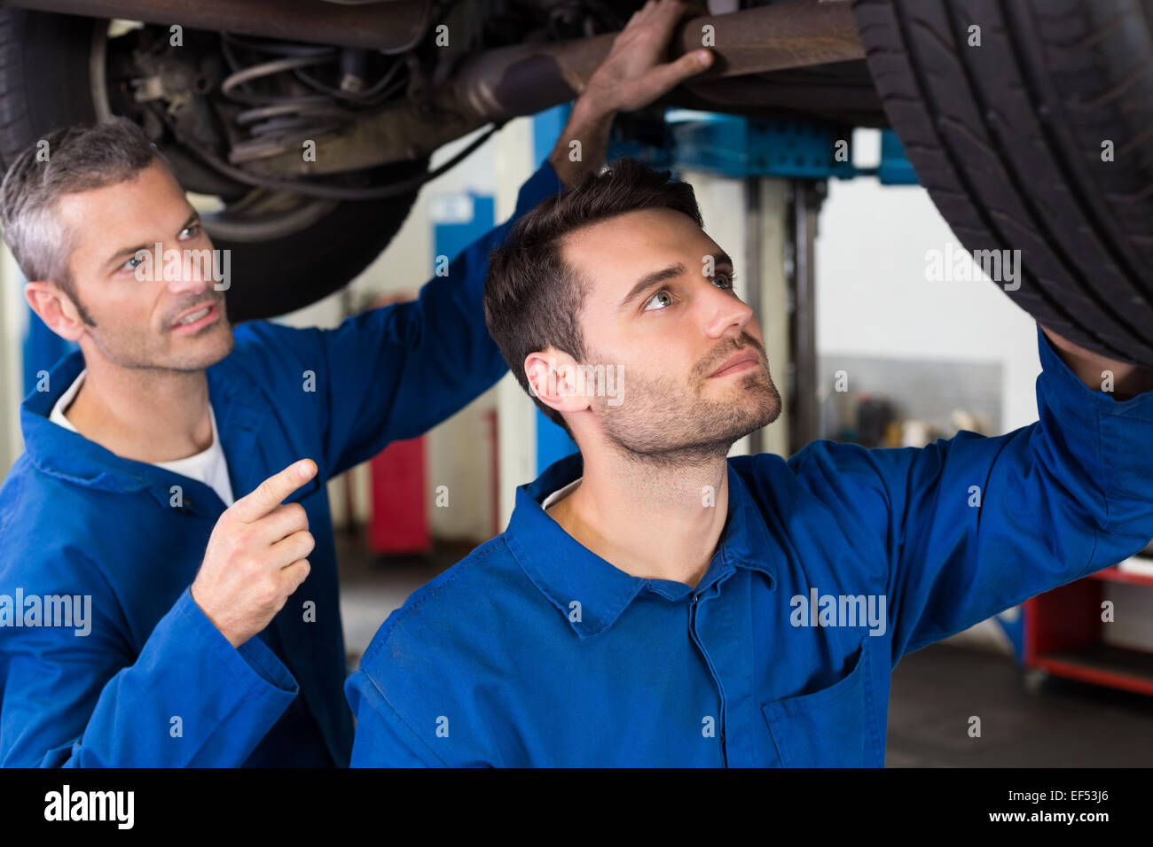 Team Mechanics Working Together High Resolution Stock Photography and ...