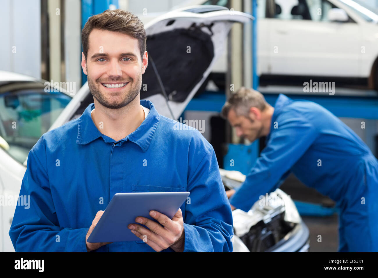 Mechanic tablet pc repairing car hi-res stock photography and images ...