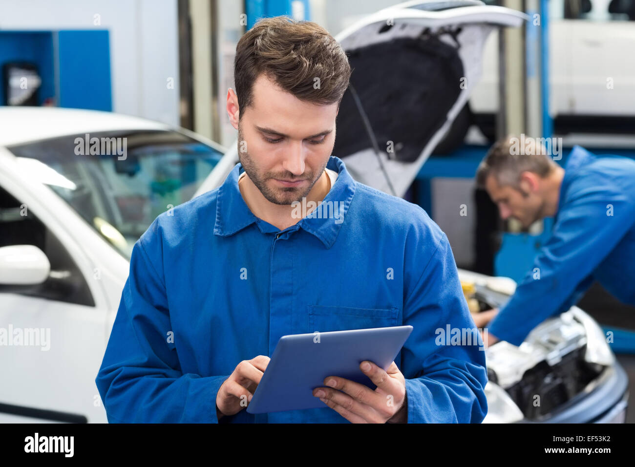 Mechanic tablet pc repairing car hi-res stock photography and images ...