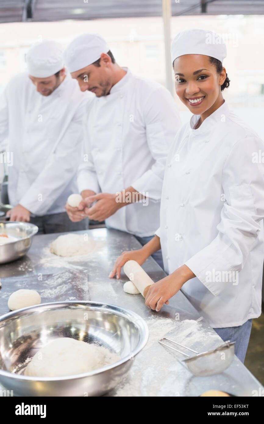 Team of bakers working at counter Stock Photo - Alamy