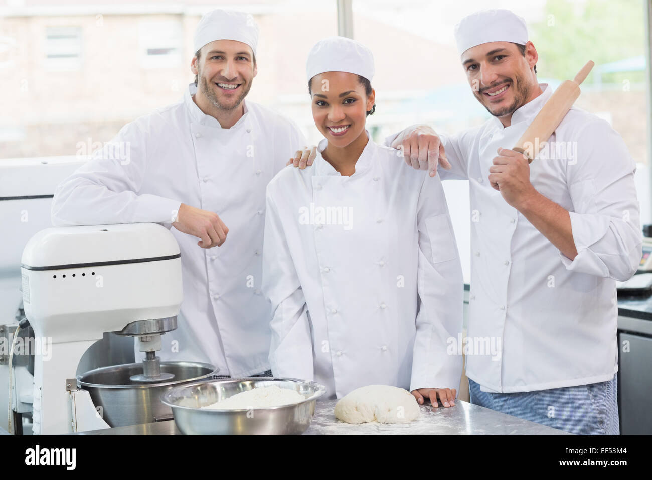 Happy bakers making dough hi-res stock photography and images - Alamy