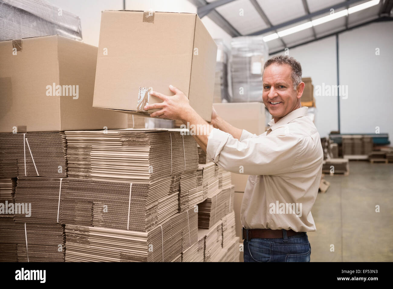 Smiling man taking box hi-res stock photography and images - Alamy