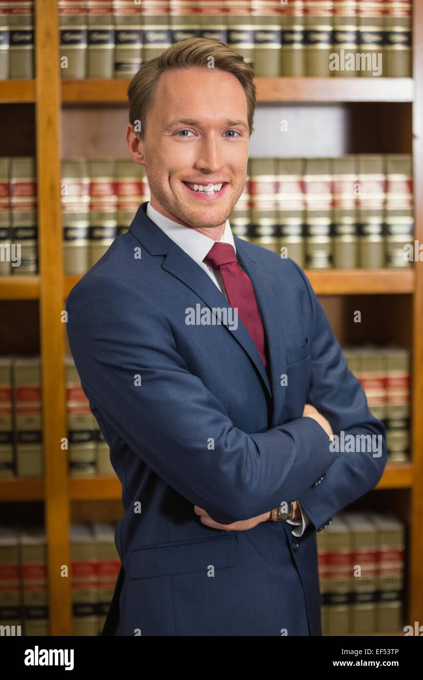 Lawyer smiling in the law library Stock Photo - Alamy