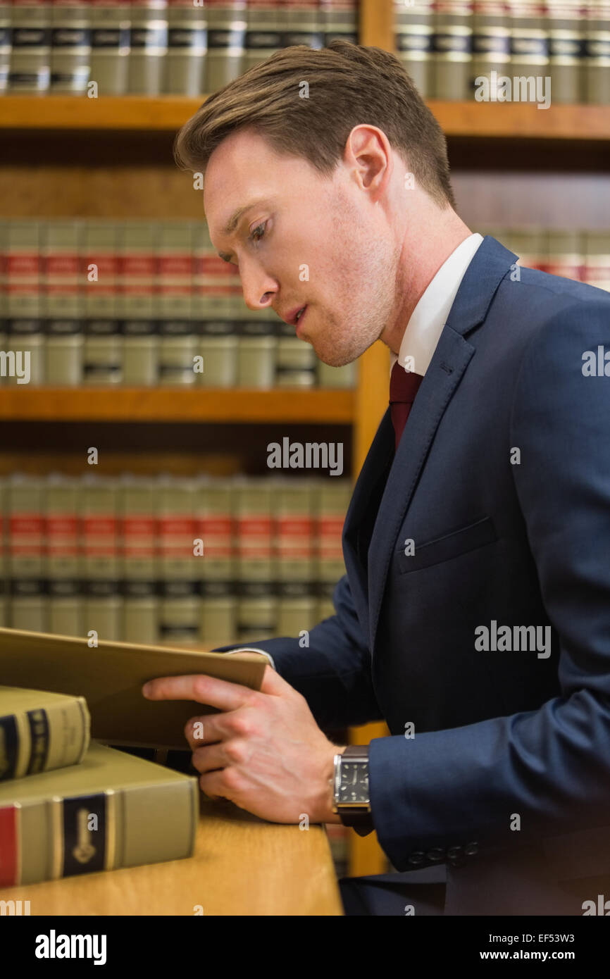 Handsome lawyer in the law library Stock Photo - Alamy
