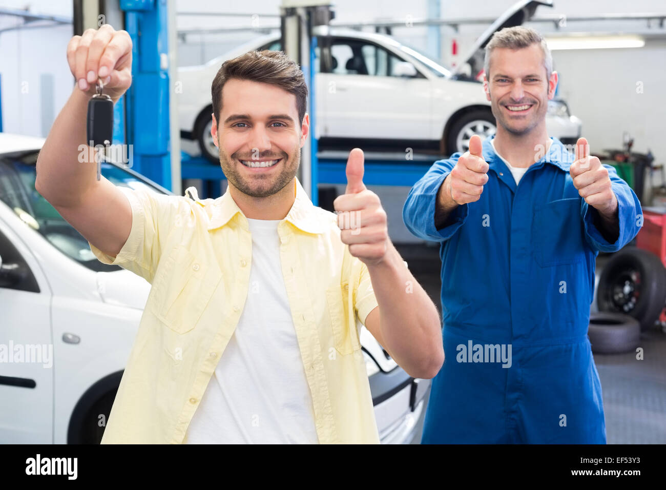 Smiling satisfied customer mechanic hi-res stock photography and images ...