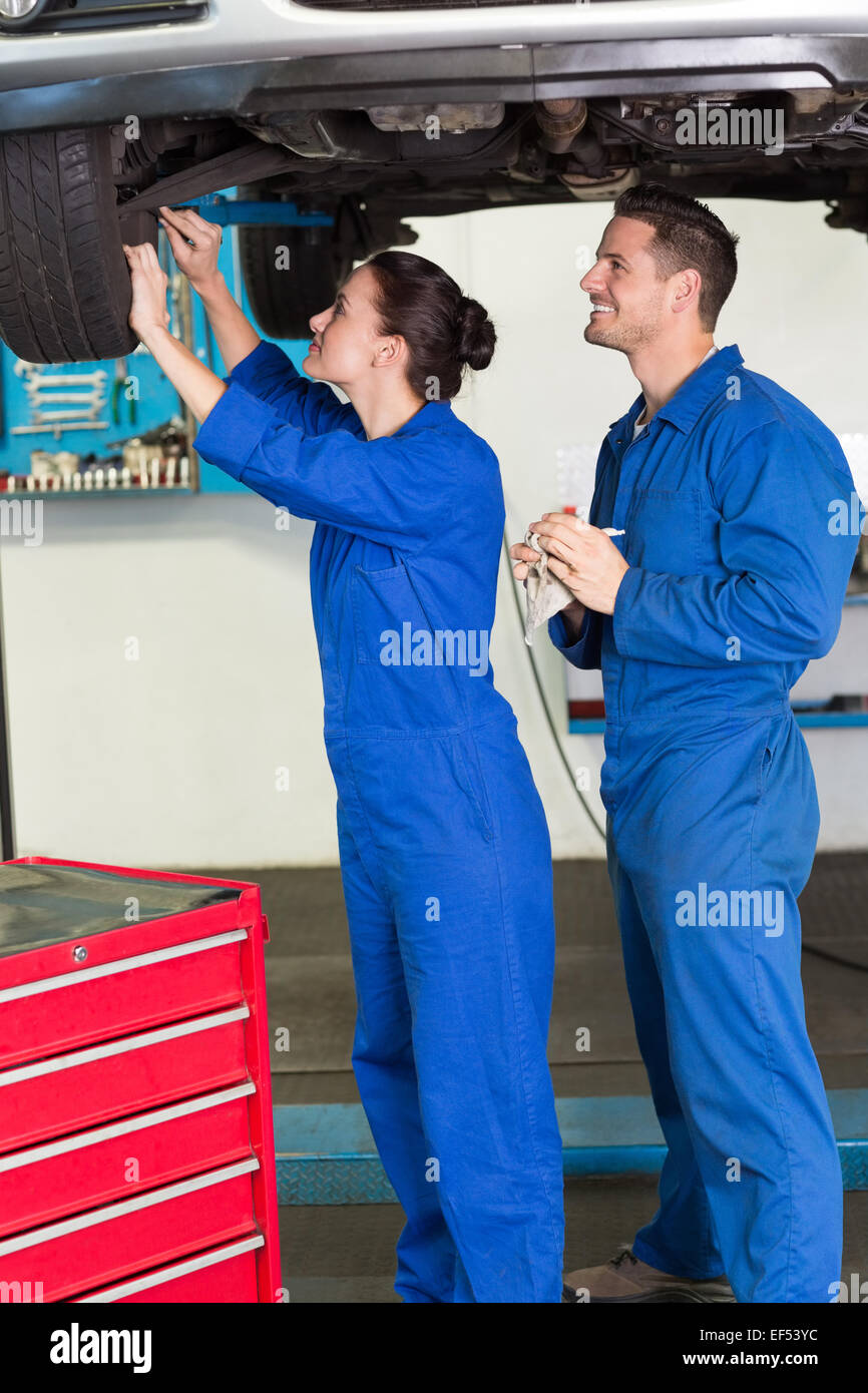 Team of mechanics working together Stock Photo - Alamy