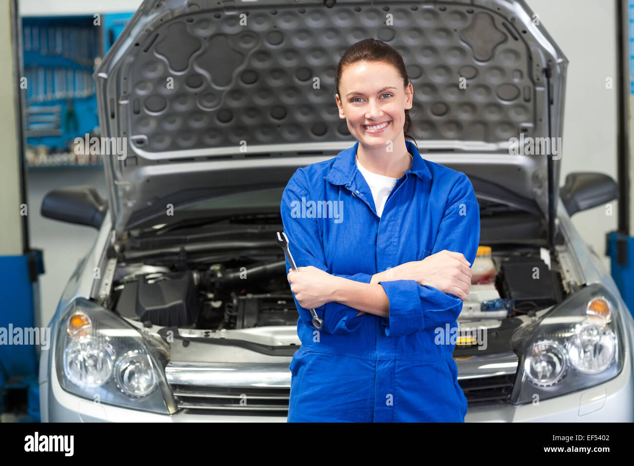 Mechanic smiling at the camera Stock Photo - Alamy