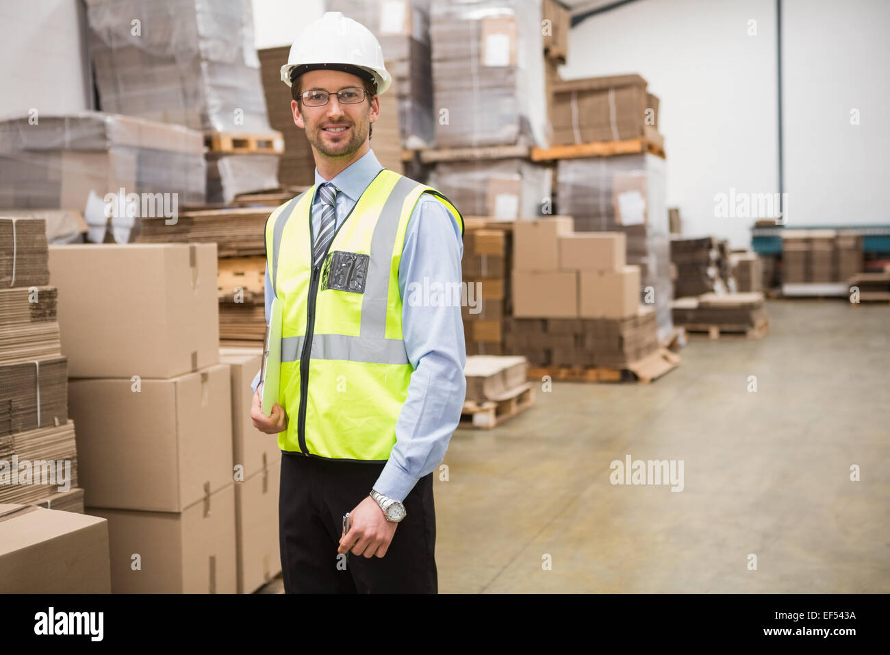 Portrait of warehouse worker with clipboard Stock Photo - Alamy