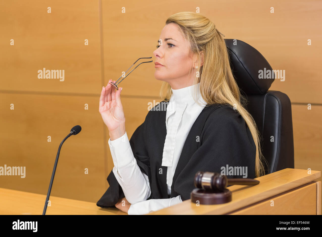 Stern judge looking and listening Stock Photo - Alamy
