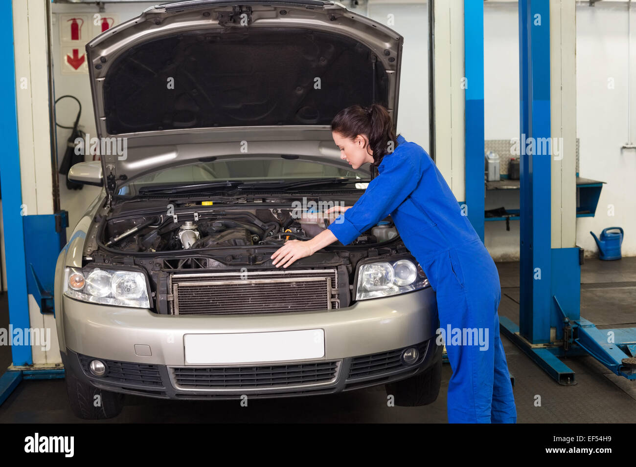 Mechanic working under the hood Stock Photo - Alamy