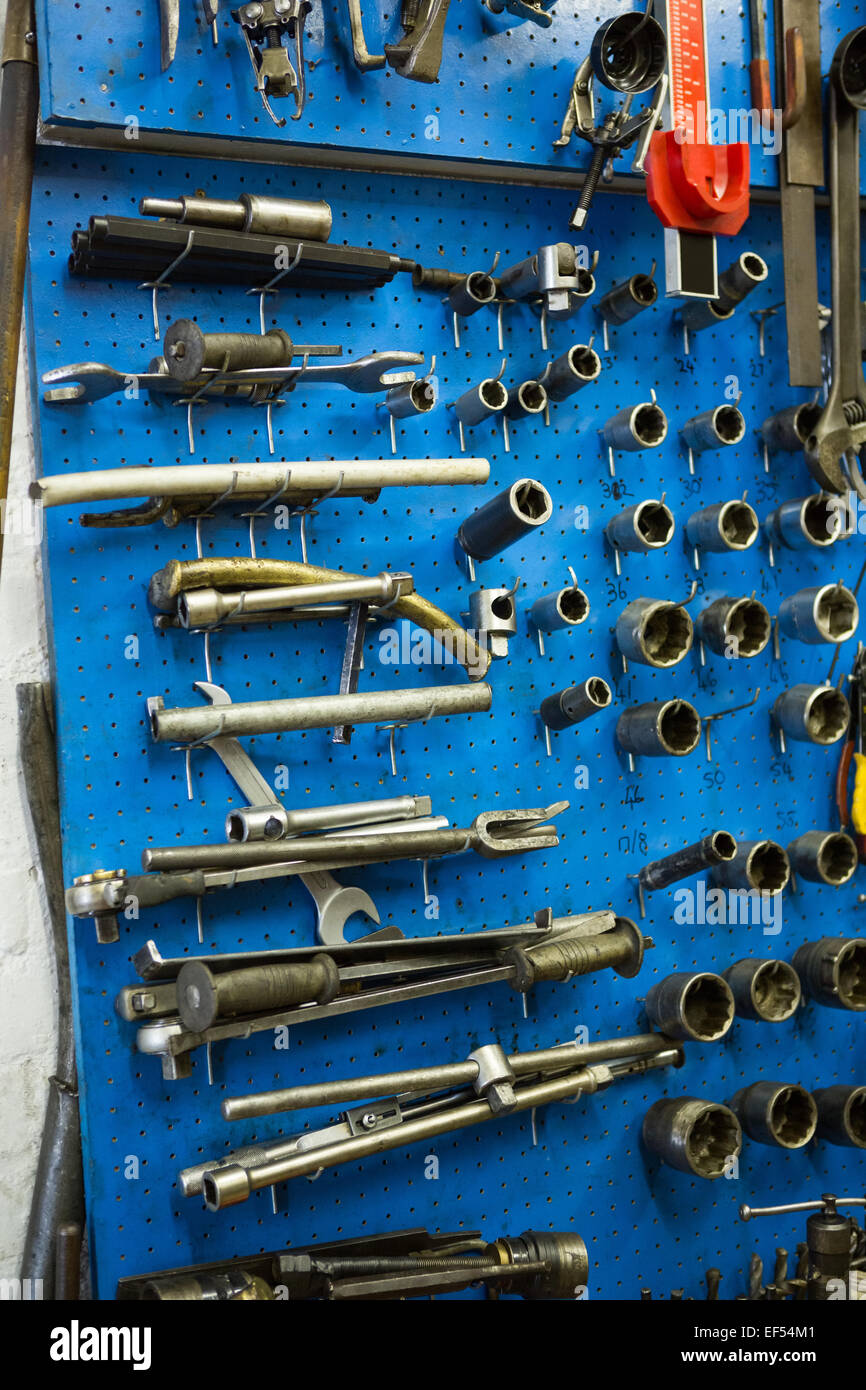 Blue storage wall for tools Stock Photo - Alamy