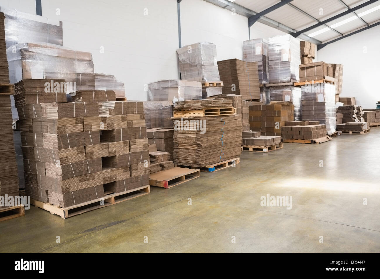 Many stack of cardboard boxes Stock Photo - Alamy