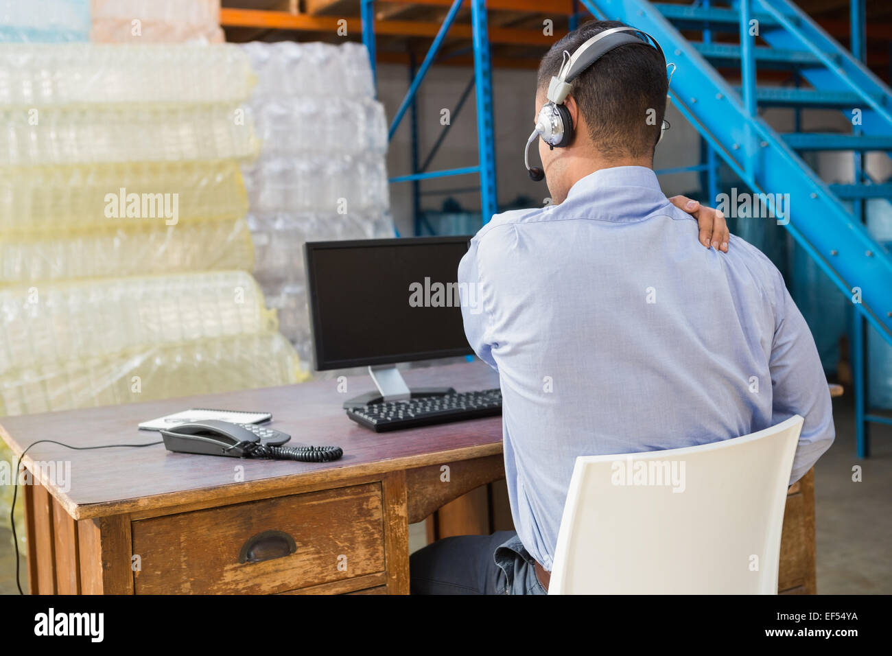 Warehouse manager working on computer Stock Photo - Alamy