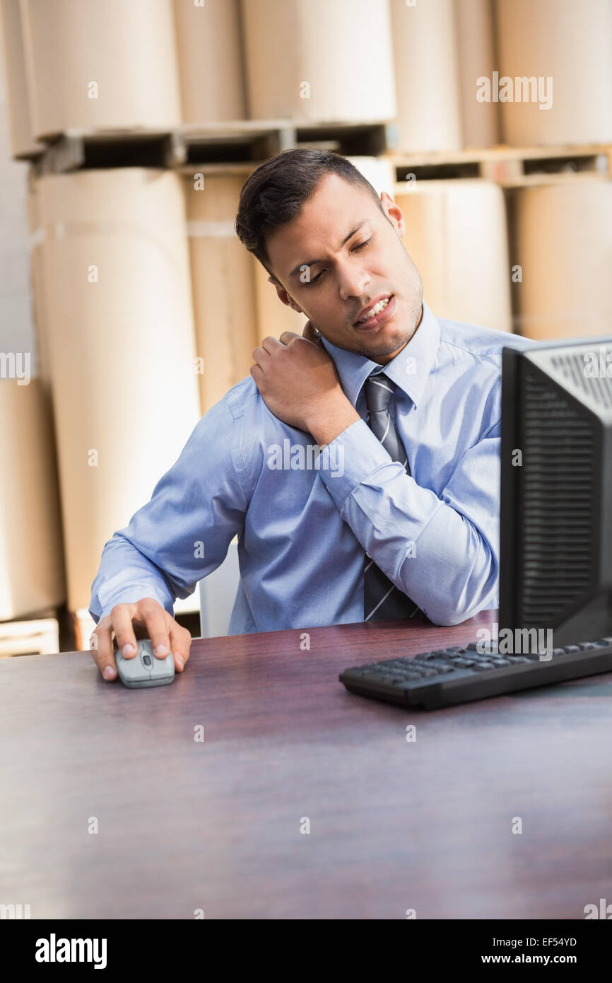 Warehouse manager working on computer Stock Photo - Alamy
