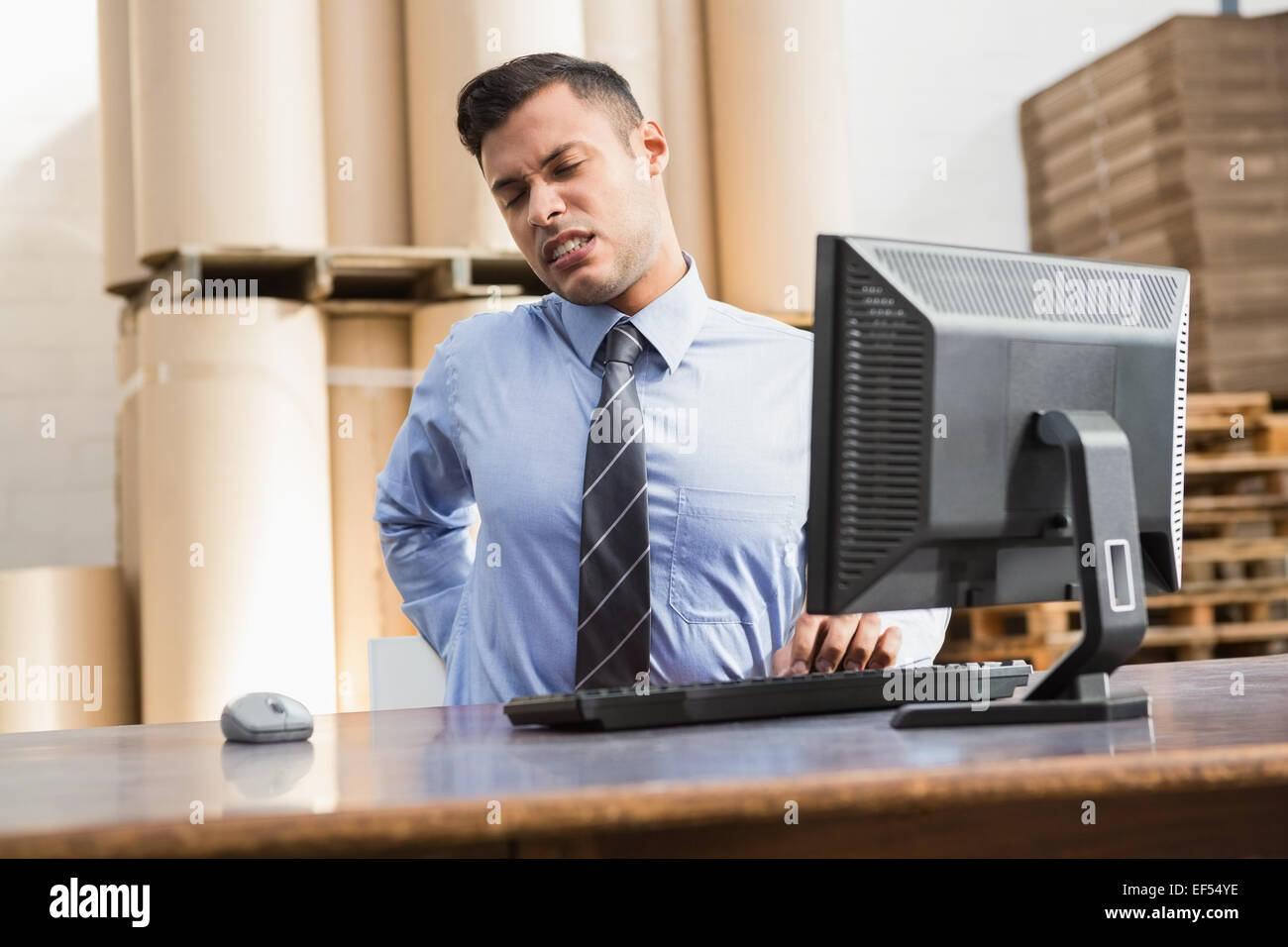 Warehouse manager working on computer Stock Photo - Alamy