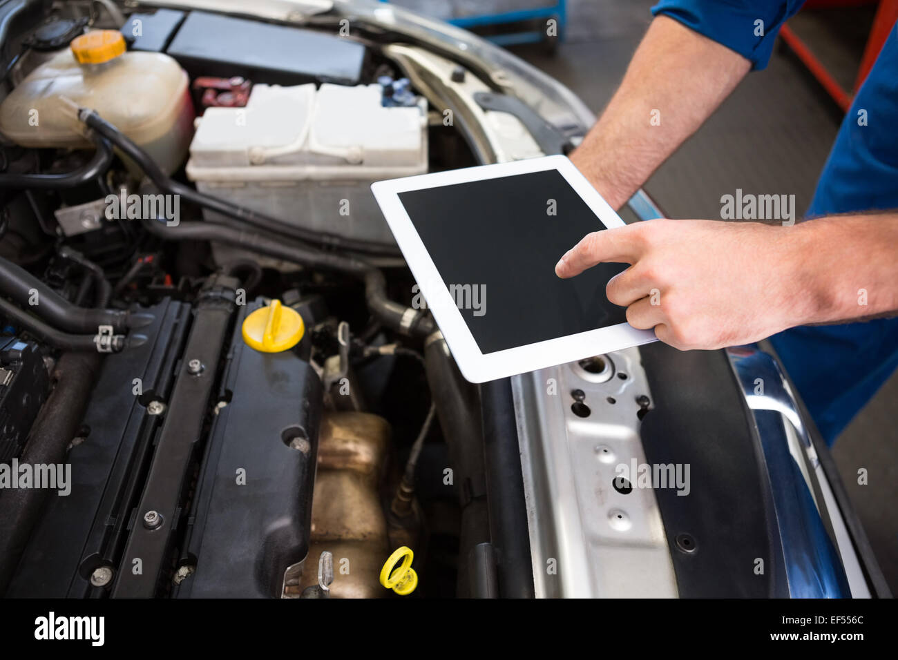 Mechanic digital tablet examining hi-res stock photography and images ...