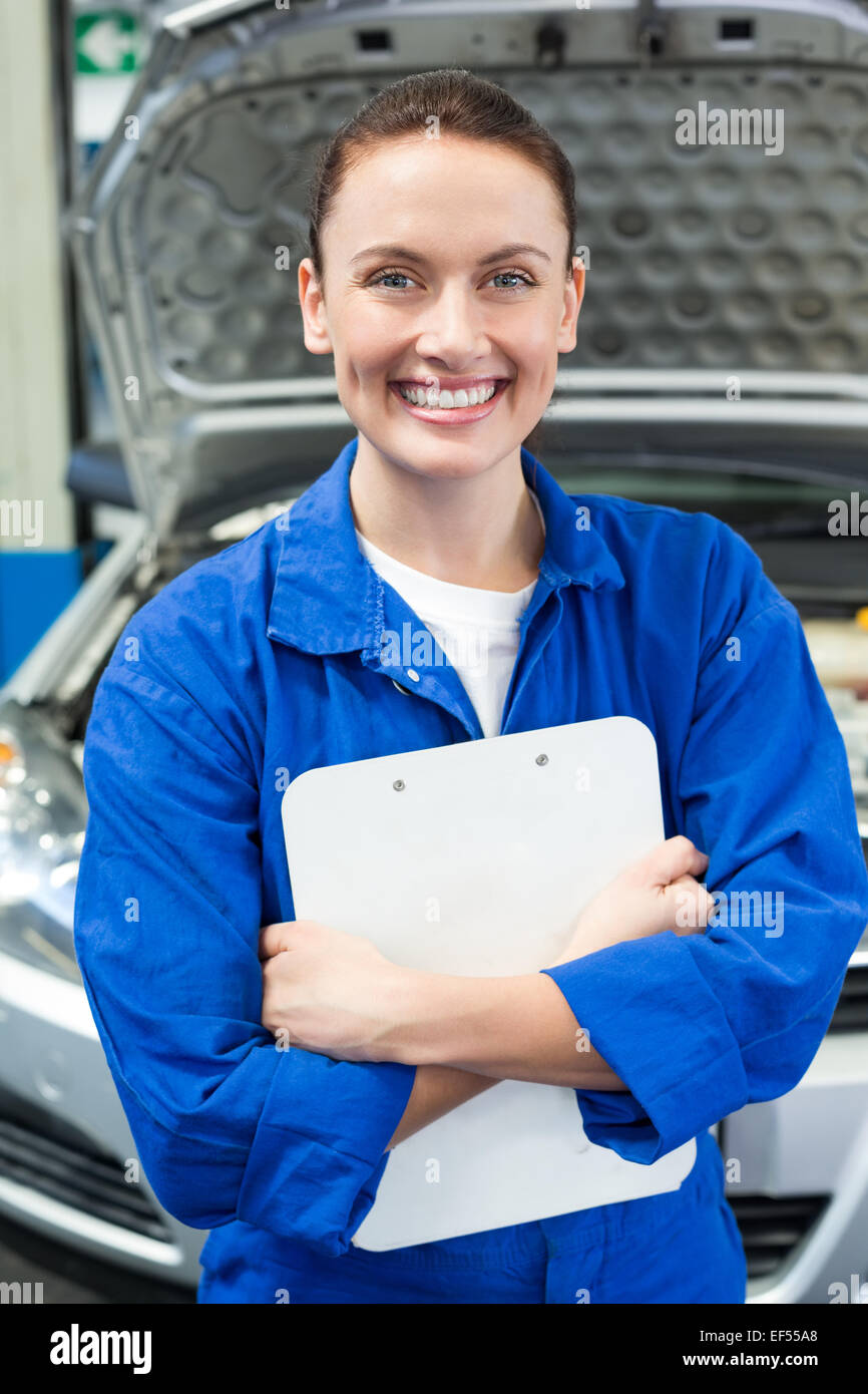 Mechanic smiling at the camera Stock Photo - Alamy