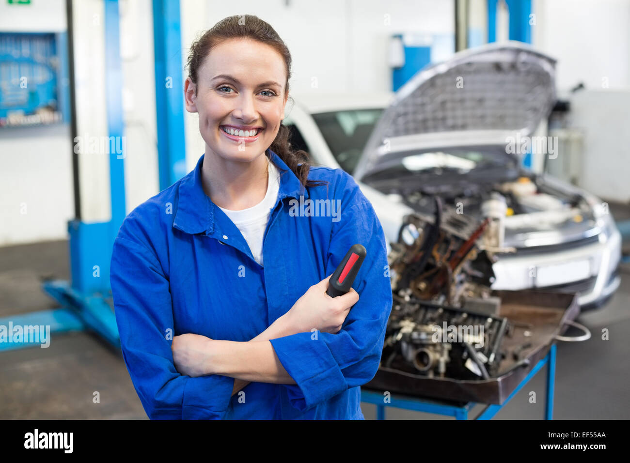 Mechanic smiling at the camera Stock Photo - Alamy