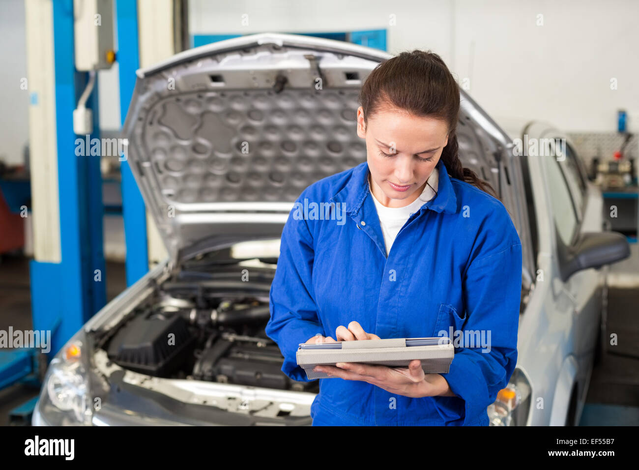 Mechanic tablet pc repairing car hi-res stock photography and images ...