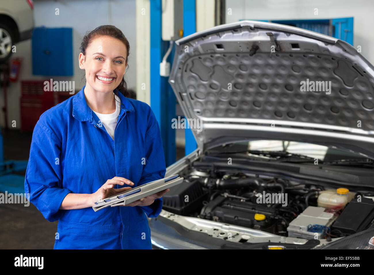 Mechanic tablet pc repairing car hi-res stock photography and images ...