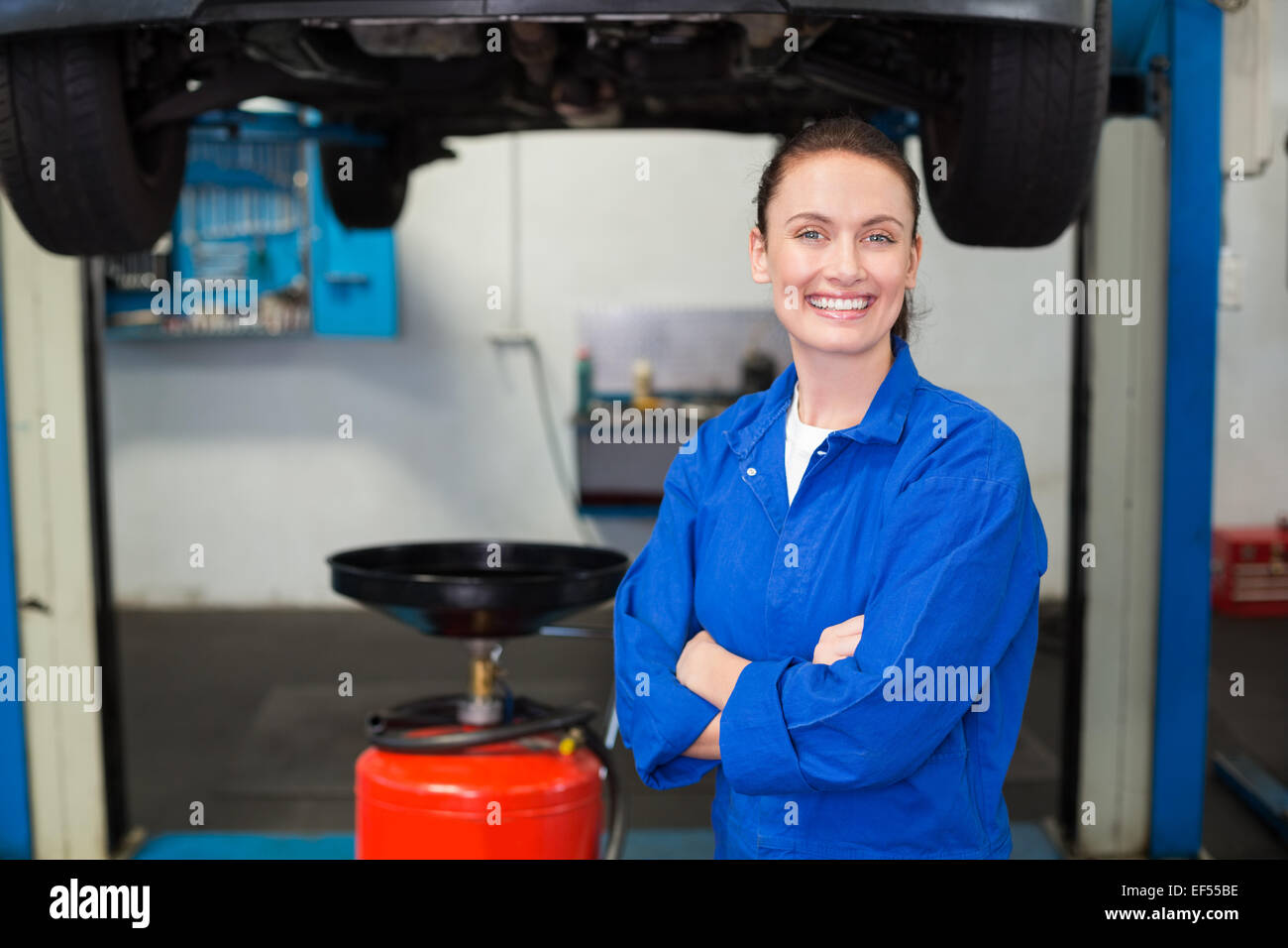 Mechanic smiling at the camera Stock Photo - Alamy