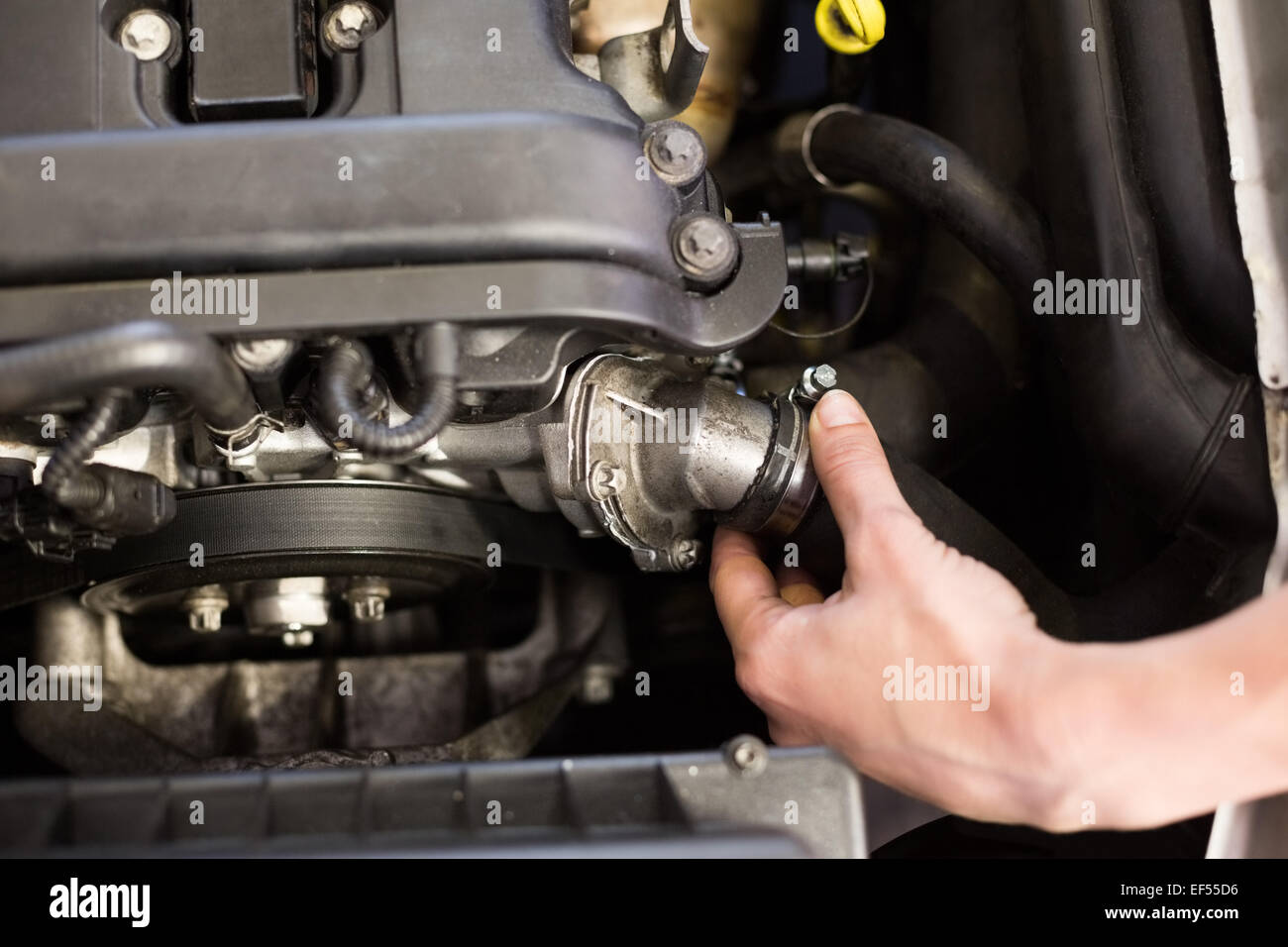 Mechanic working on an engine Stock Photo - Alamy