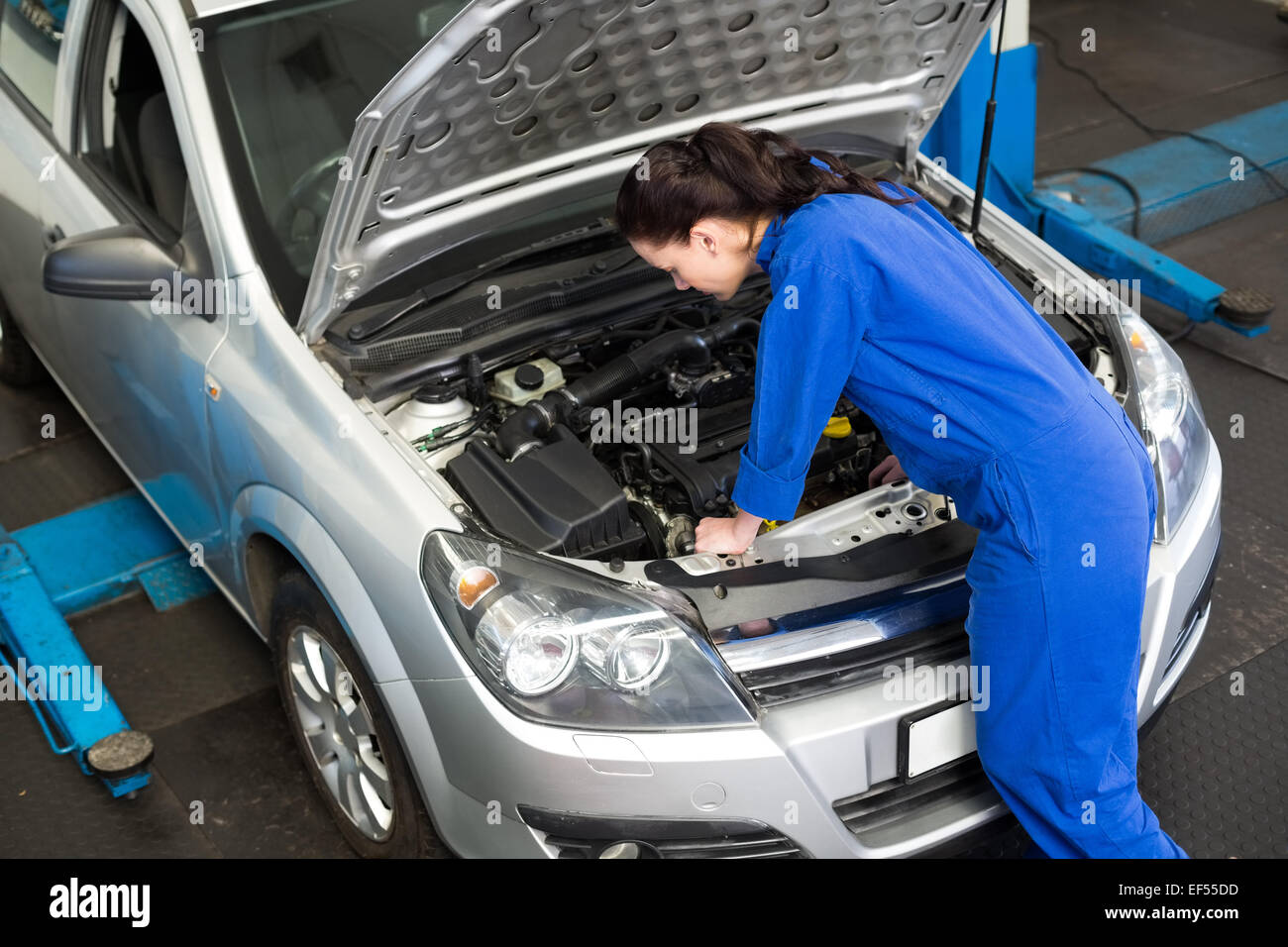Mechanic working under the hood Stock Photo - Alamy