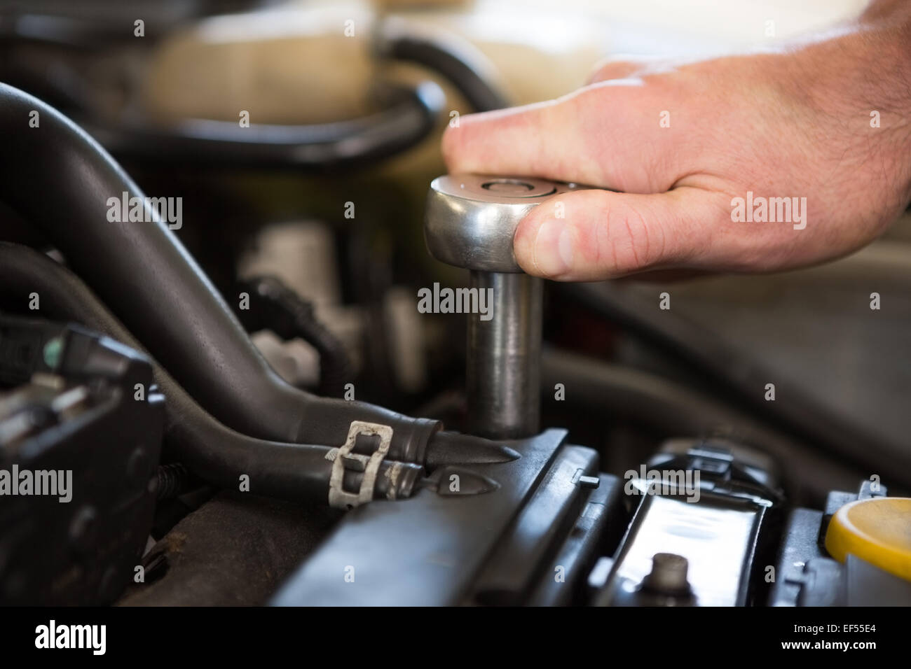 Mechanic working on an engine Stock Photo - Alamy