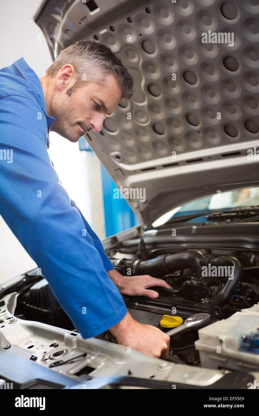 Mechanic working on an engine Stock Photo - Alamy
