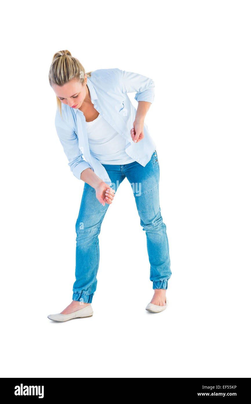 Pretty blonde in casual clothes pulling Stock Photo - Alamy